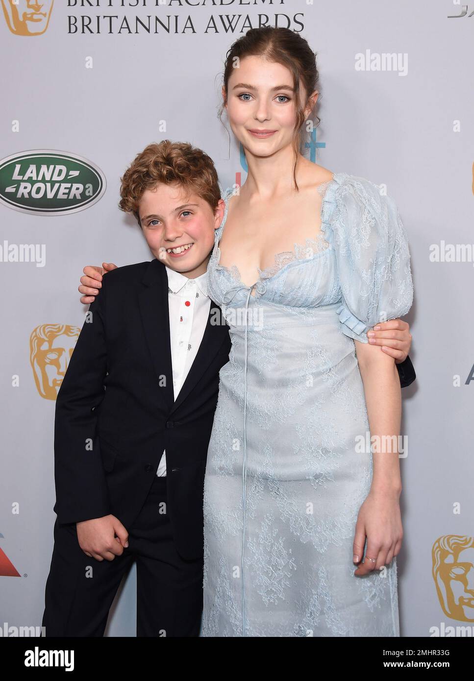 Roman Griffin Davis, left, and Thomasin McKenzie arrive at the BAFTA ...