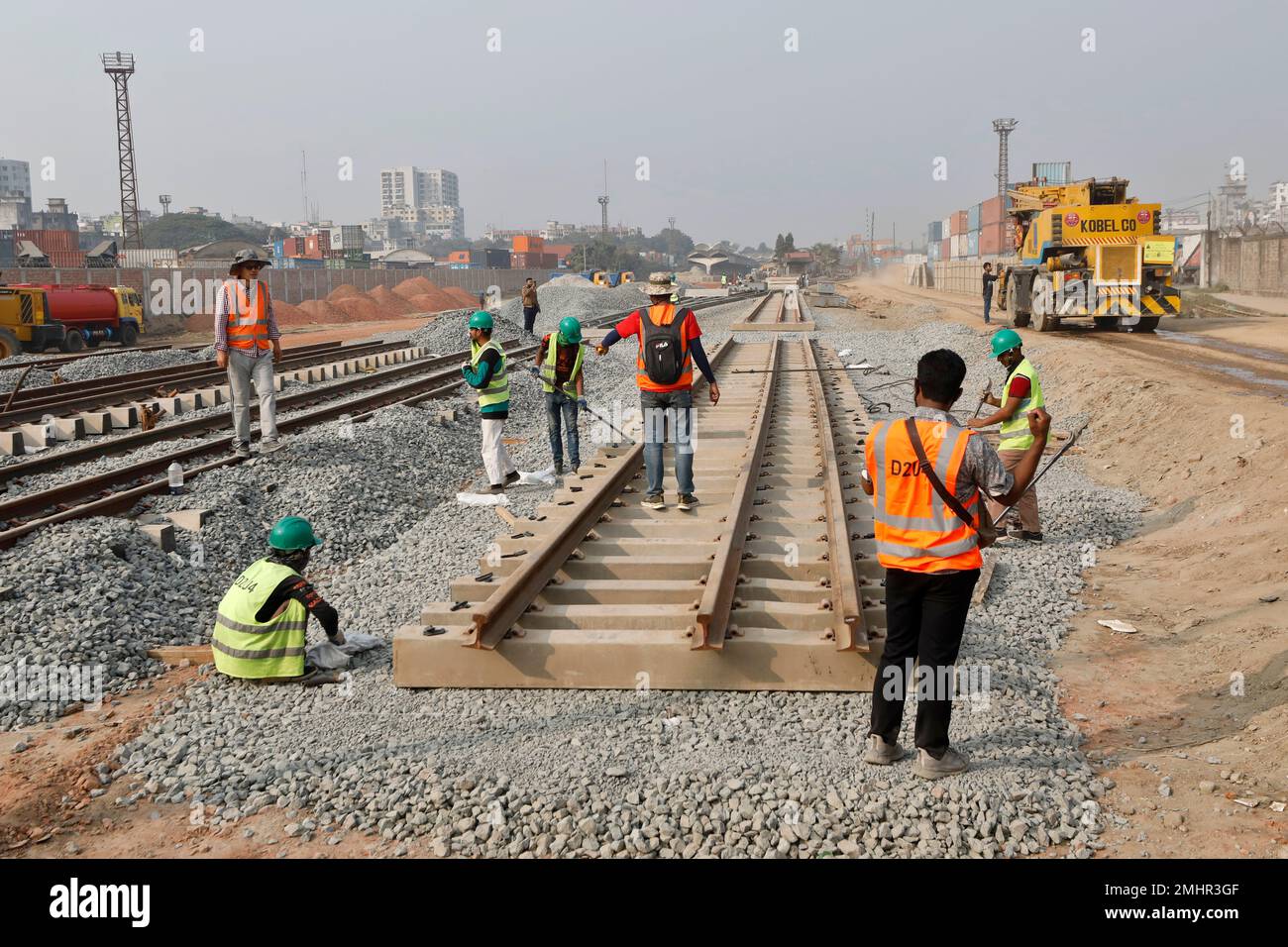 Dhaka, Bangladesh - January 27, 2023: Workers are working to connect ...