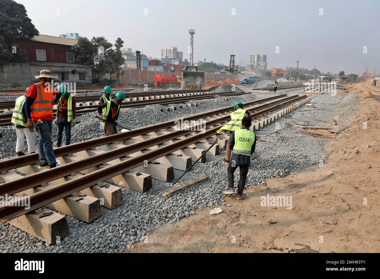 Dhaka, Bangladesh - January 27, 2023: Workers are working to connect ...