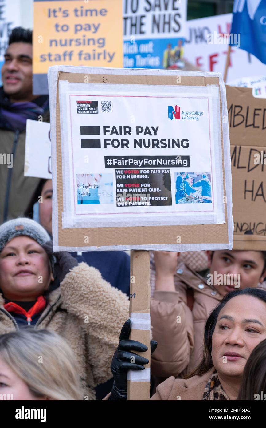 Striking nurses with placards, demonstrating outside University College ...