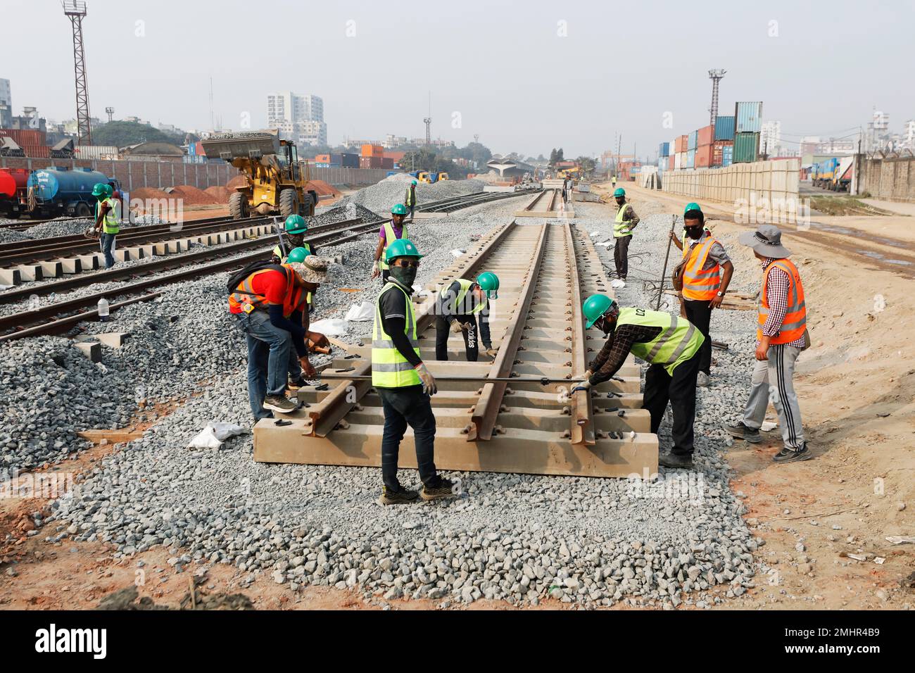 Dhaka, Bangladesh - January 27, 2023: Workers are working to connect ...