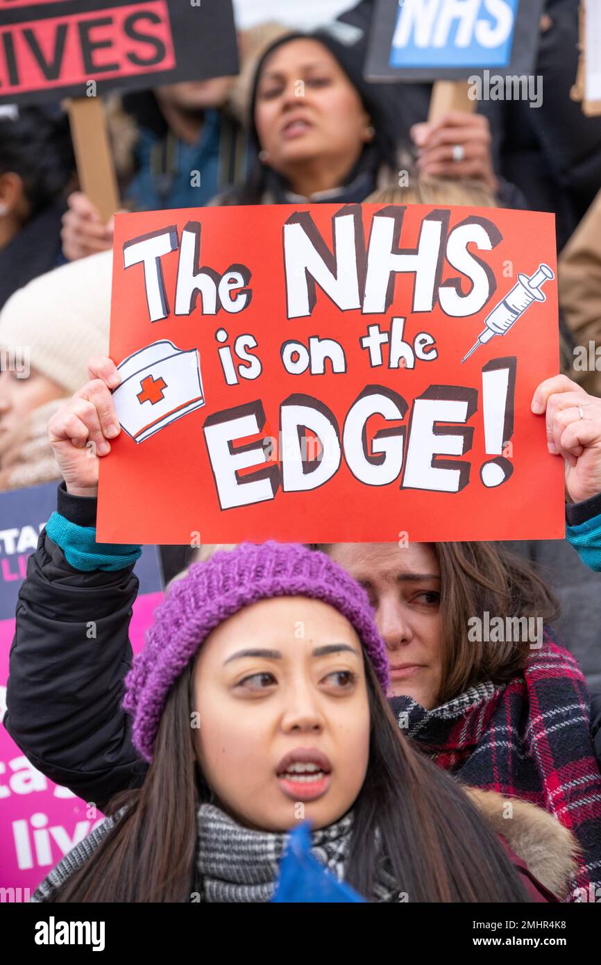 Striking nurses with placards, demonstrating outside University College ...