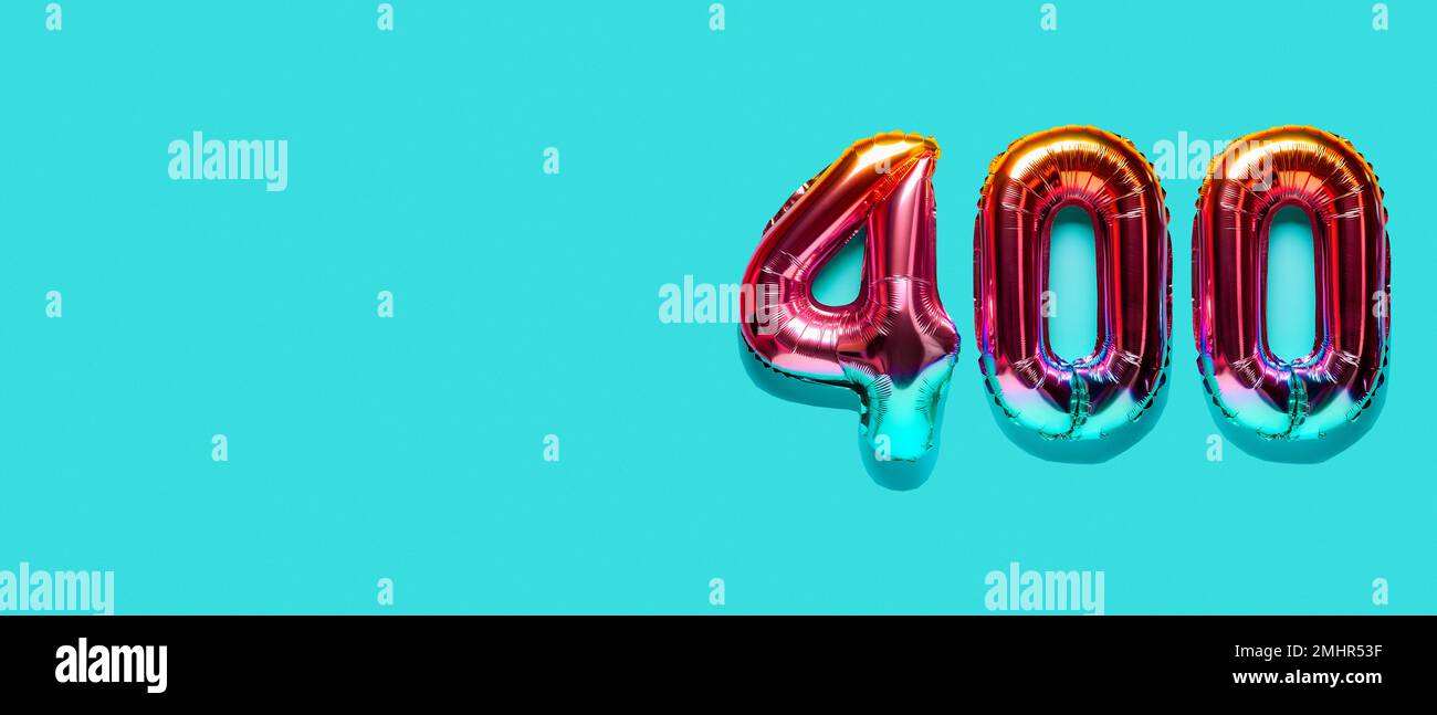 Rainbow foil balloon number, digit four hundred. Top view. Colored ...