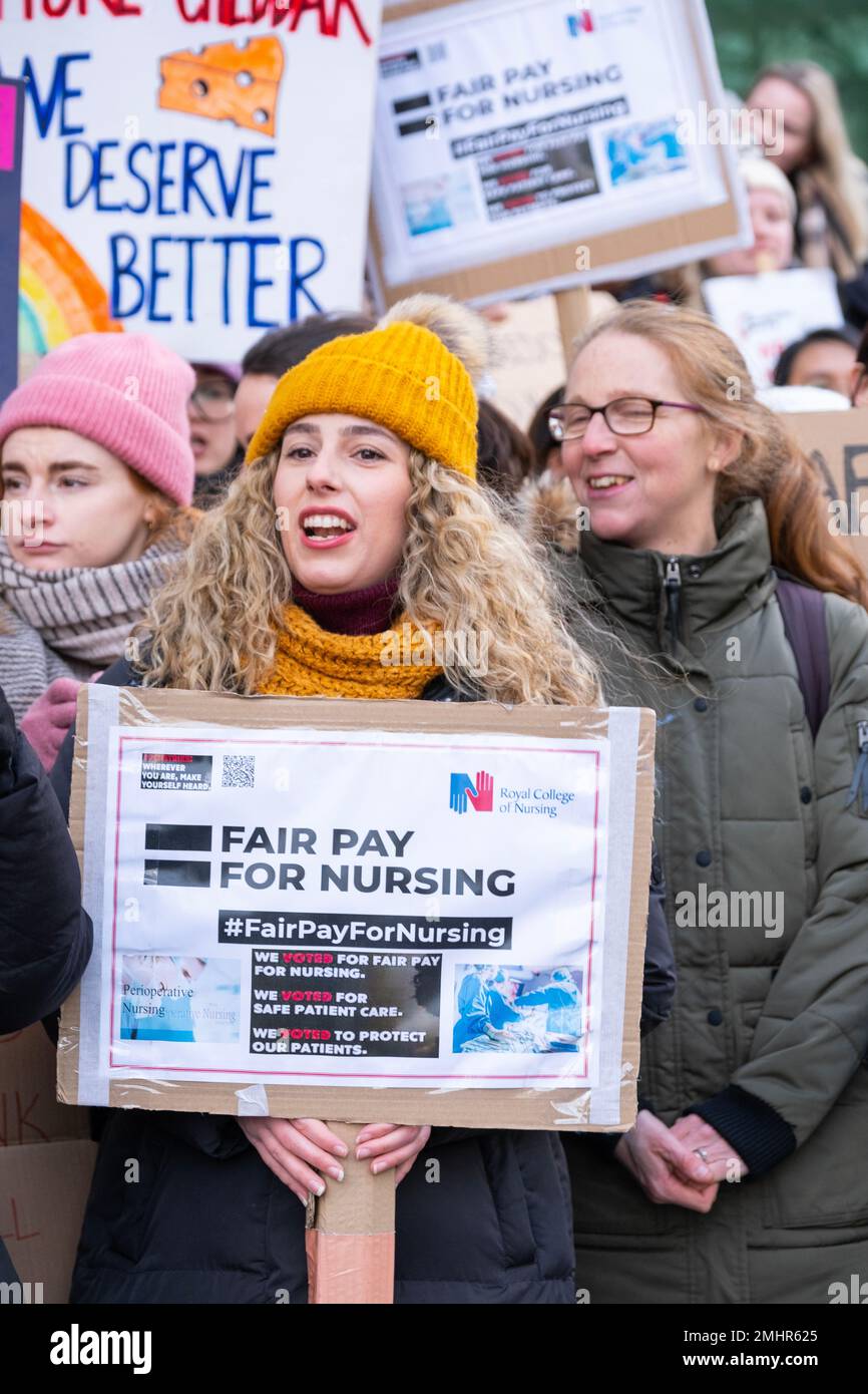 Striking nurses with placards, demonstrating outside University College ...