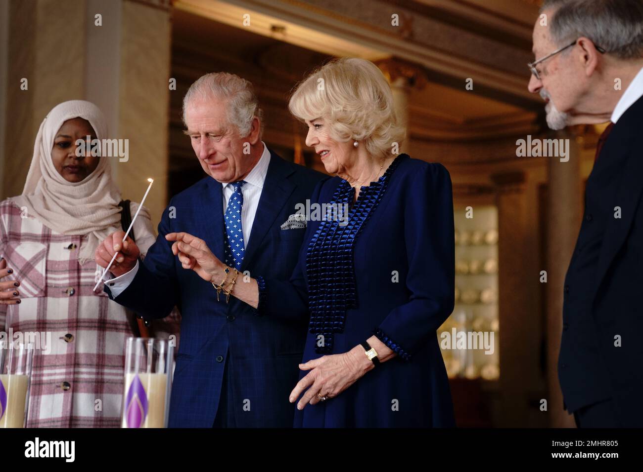 King Charles III and the Queen Consort light two candles at Buckingham ...