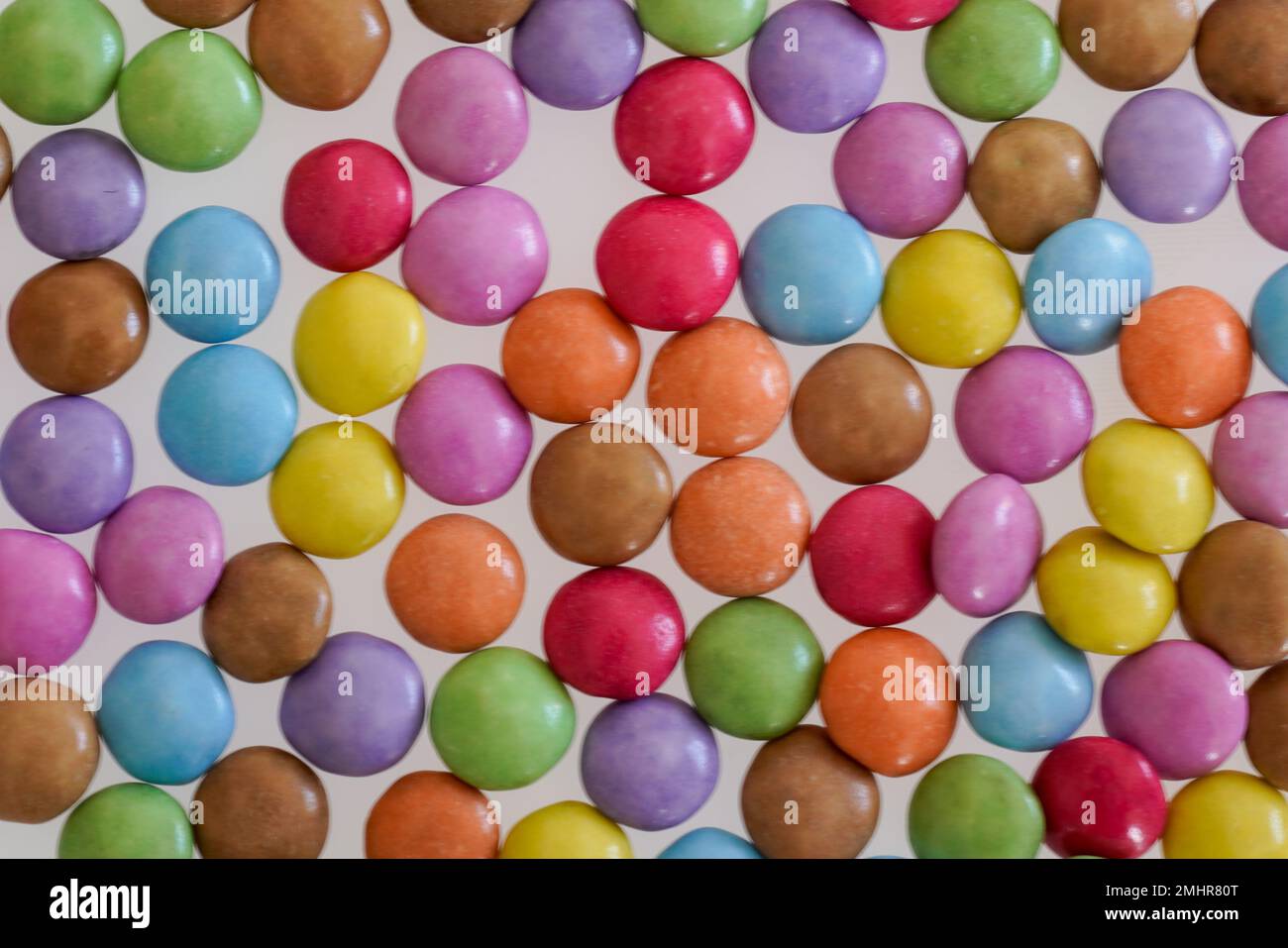 candies background colorful sugar coated candy border Stock Photo - Alamy