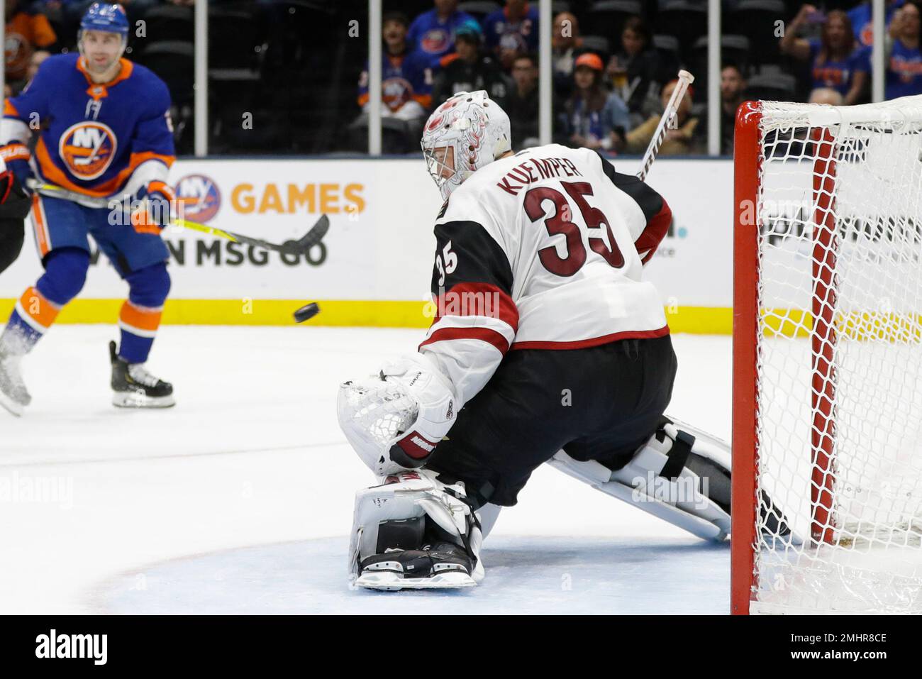 Arizona Coyotes goaltender Darcy Kuemper (35) watches the puck shot by ...