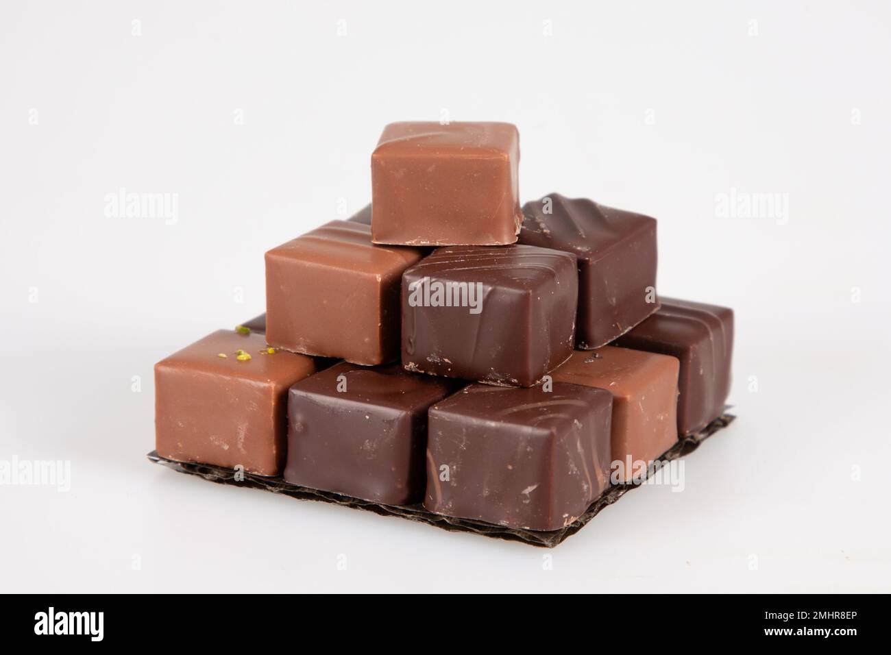 variety chocolate pralines in pyramid view in white background Stock ...
