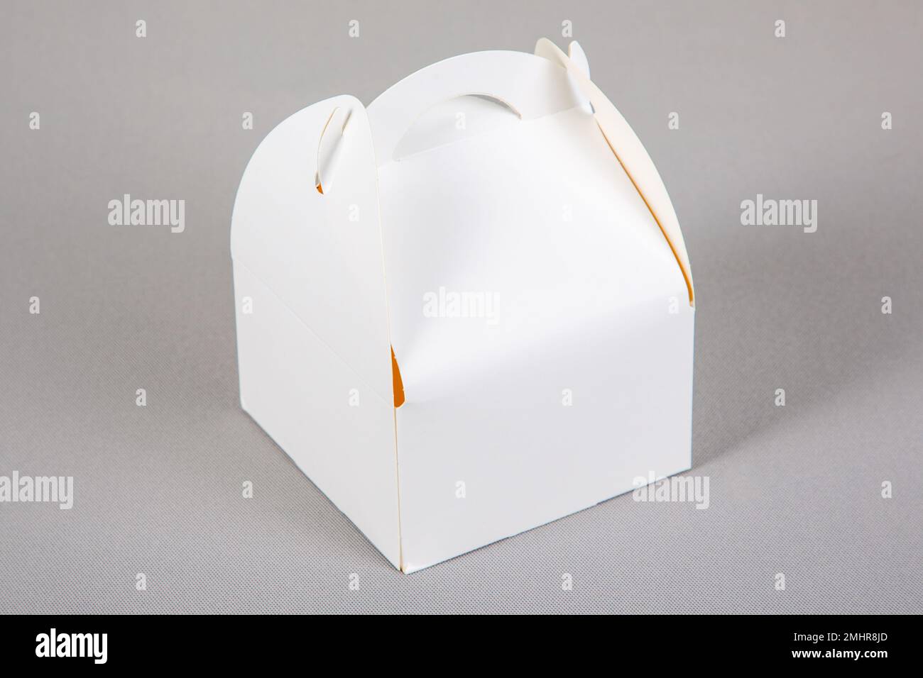 White small blank empty text sign paper pastry candy box with handle in ...