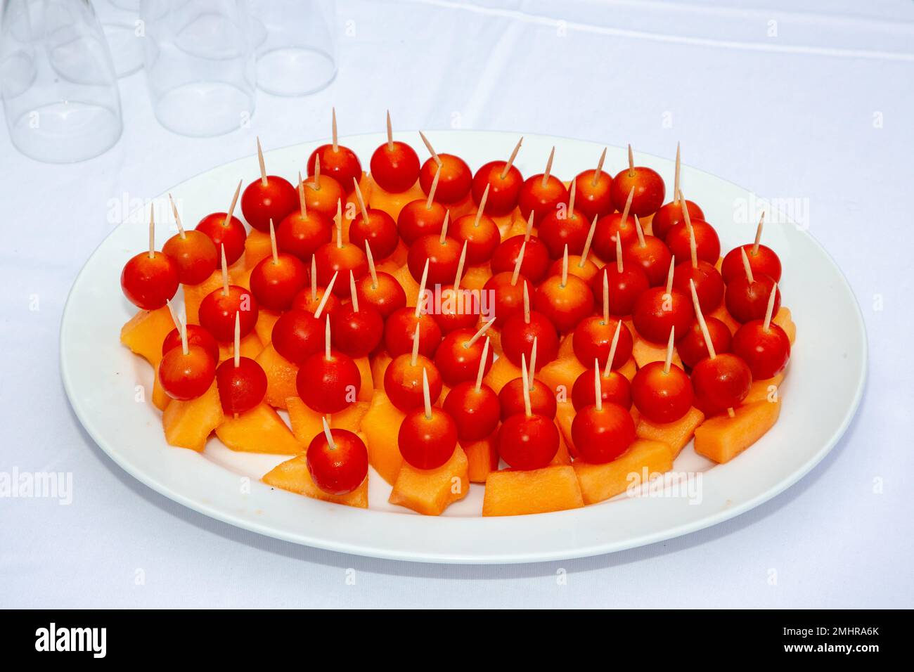 appetizers on the buffet table with tomato melon Stock Photo - Alamy