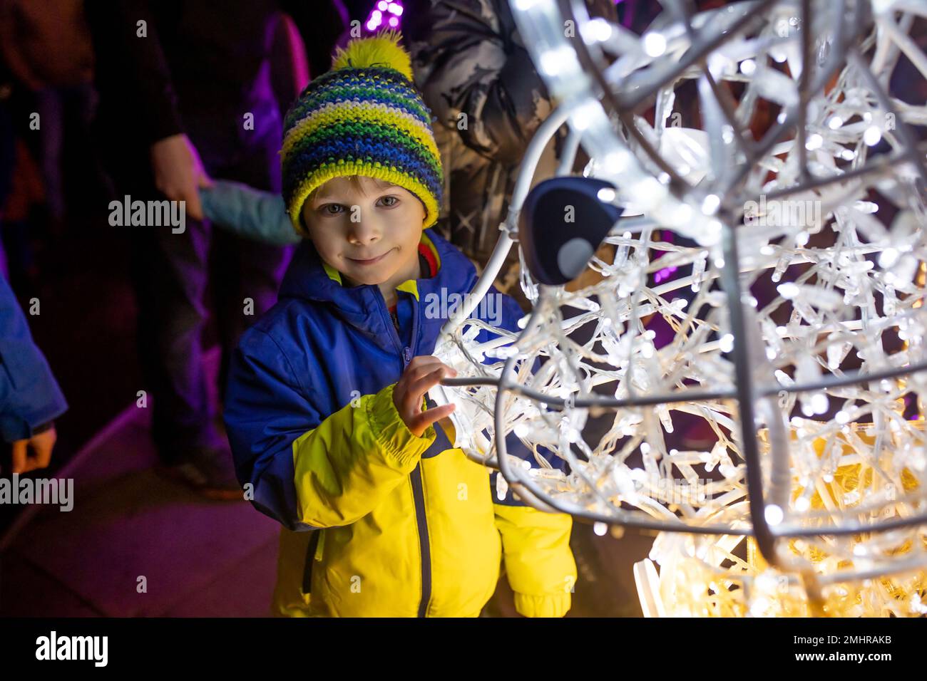 Cute child, boy, watching at lights in light show park, closeup Stock ...