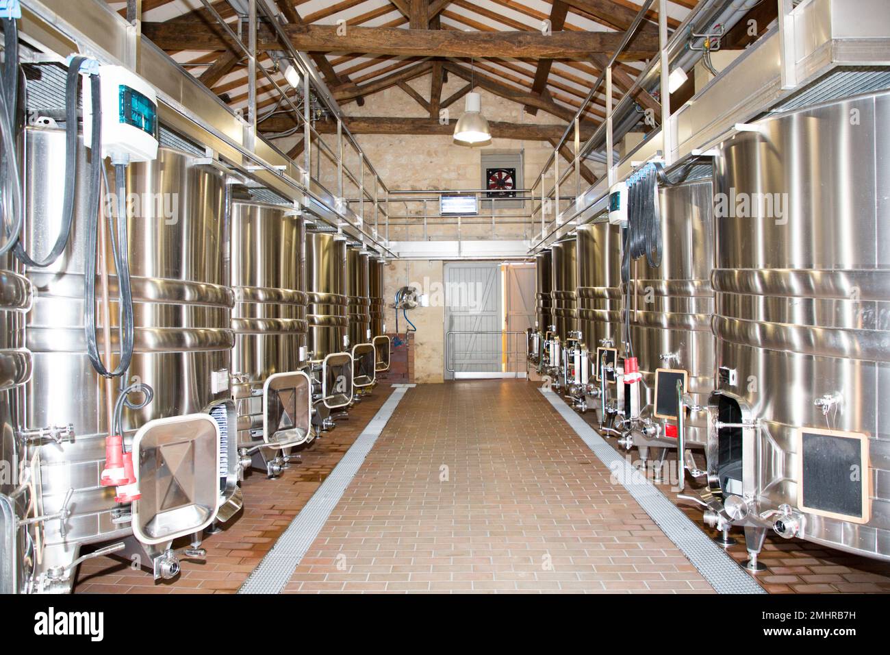 Modern winery interior with aluminium stainless steel wine vats in a ...