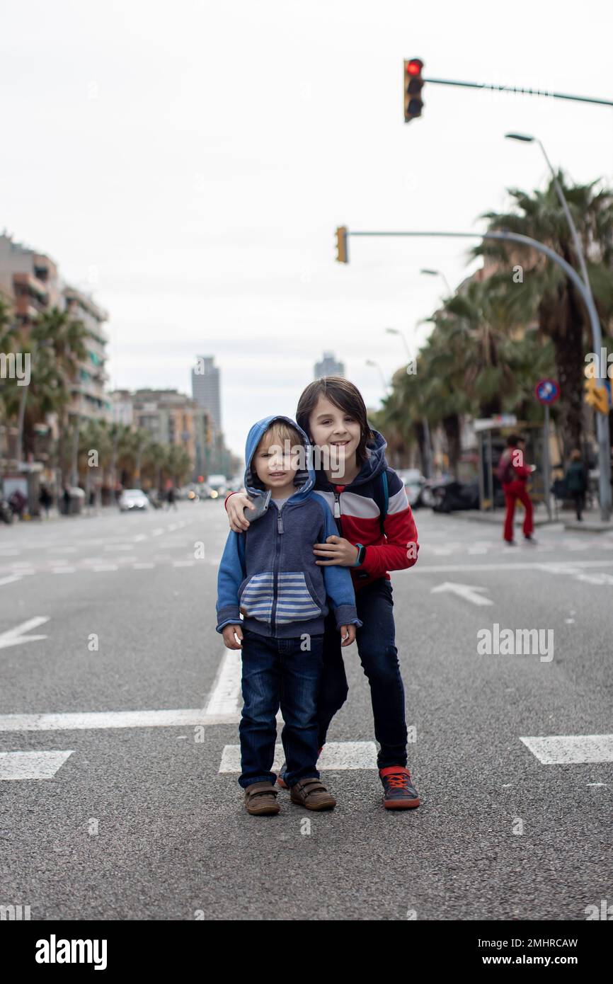 Cute little children tourists admiring Barcelona city, family travel ...