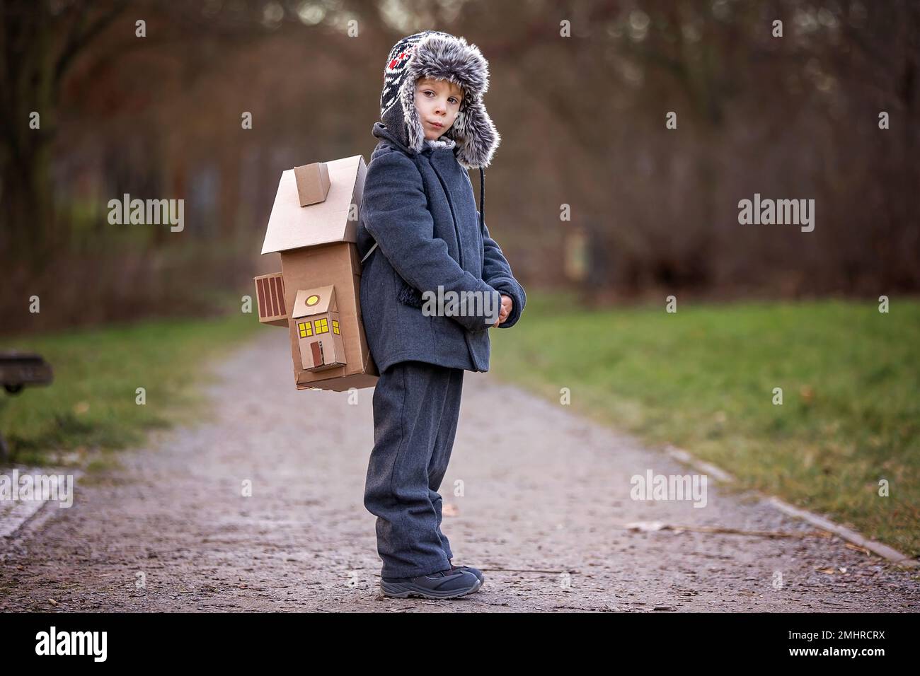 Little child, blond boy with pet dog, carying home on his back, kid ...