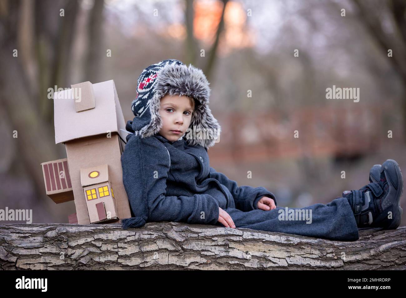 Little child, blond boy with pet dog, carying home on his back, kid ...