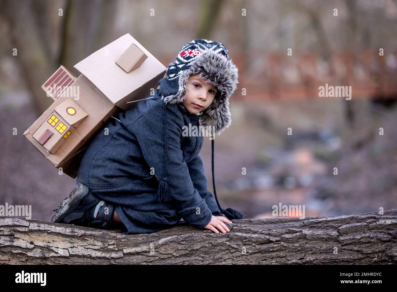 Little child, blond boy with pet dog, carying home on his back, kid ...