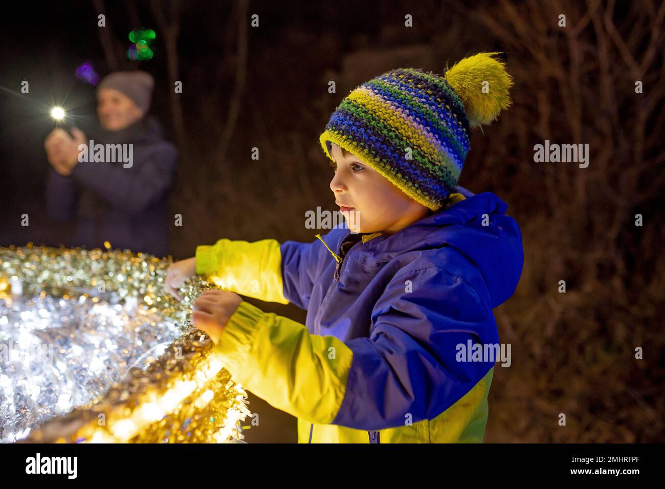 Cute child, boy, watching at lights in light show park, closeup Stock ...