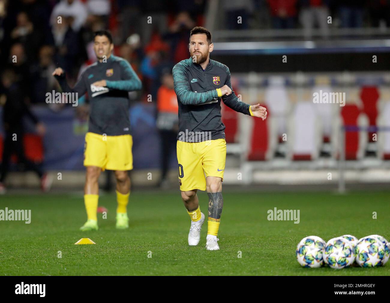 Barcelona's Lionel Messi, right, and Barcelona's Luis Suarez stretch ...
