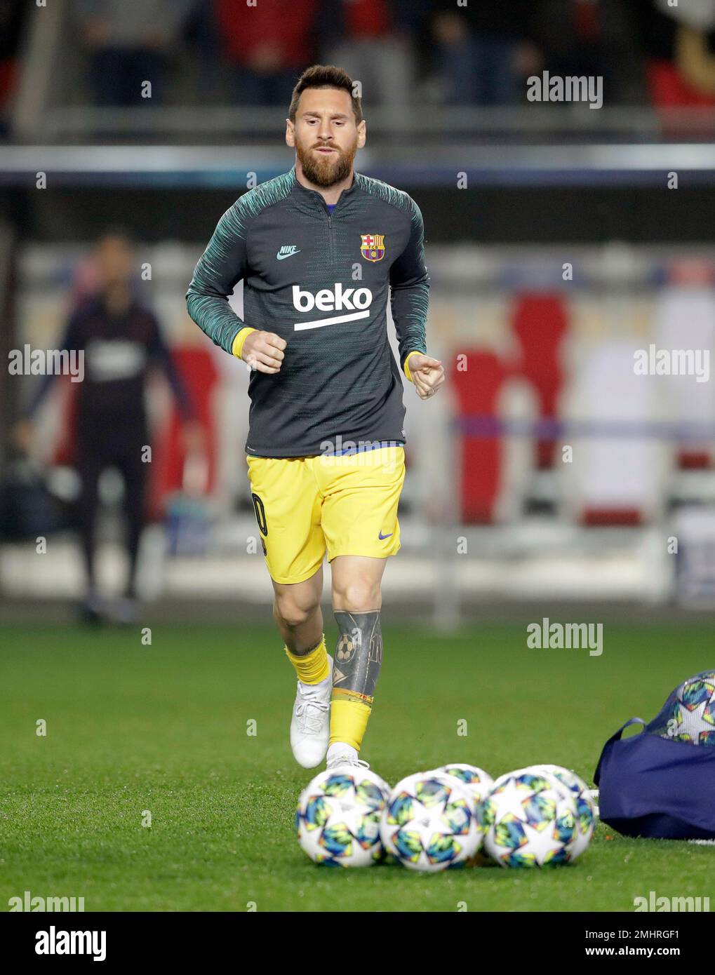 Barcelona's Lionel Messi runs during warmup before the Champions League ...