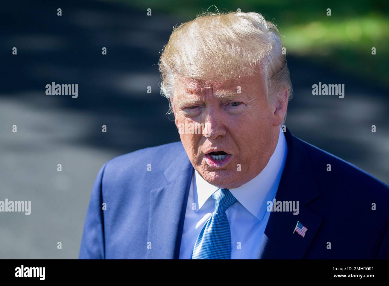 President Donald Trump speaks with reporters on the South Lawn of the ...