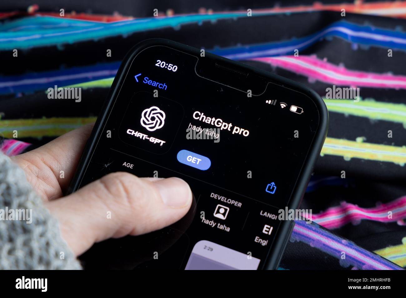 Woman's hand holding an iPhone with appstore and ChatGPT and Chat bot ...