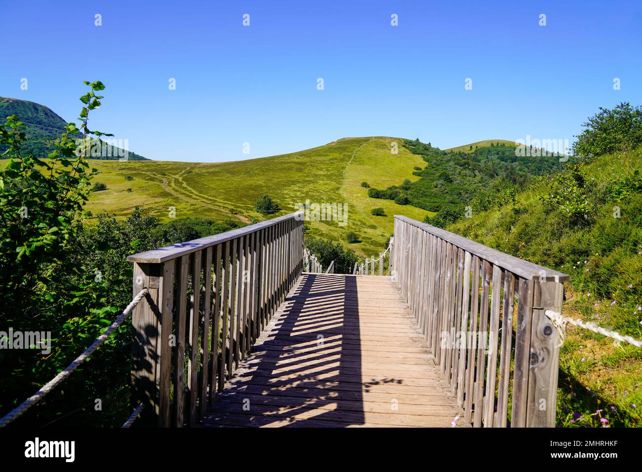 wooden bridge path at top of mountain with view of the valley Stock ...