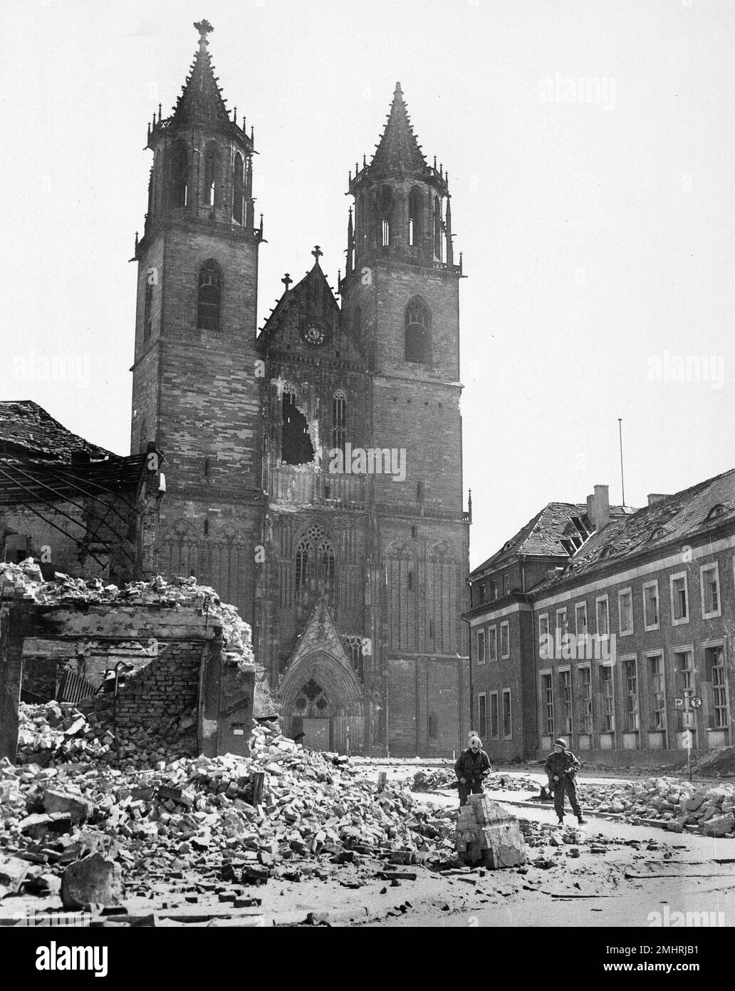 U.S. soldiers of the Ninth Army stand before the cathedral in captured ...