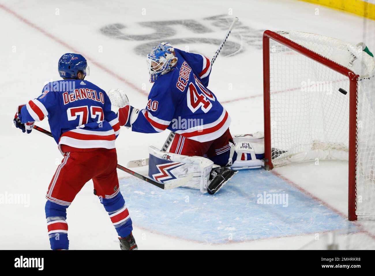 New York Rangers defenseman Tony DeAngelo (77) and goaltender Alexandar ...