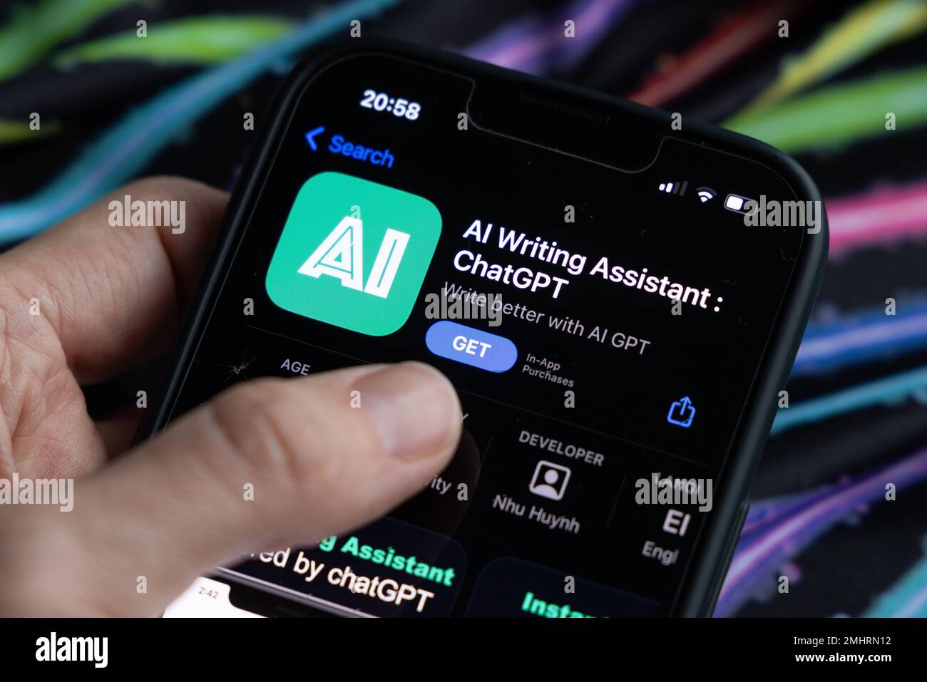 Woman's hand holding an iPhone with appstore and ChatGPT and Chat bot ...