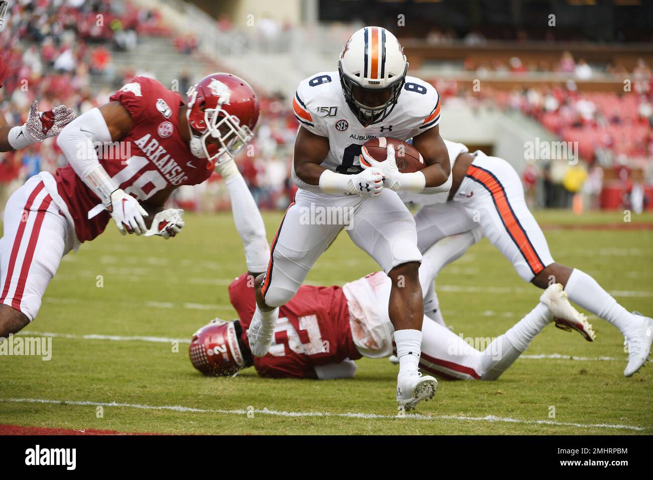 Auburn running back Shaun Shivers slips past Arkansas defenders to ...