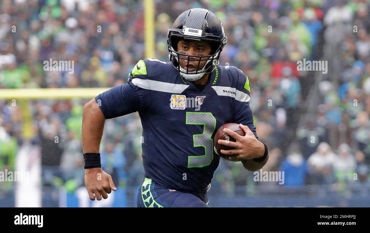 Seattle Seahawks quarterback Russell Wilson rushes against the ...