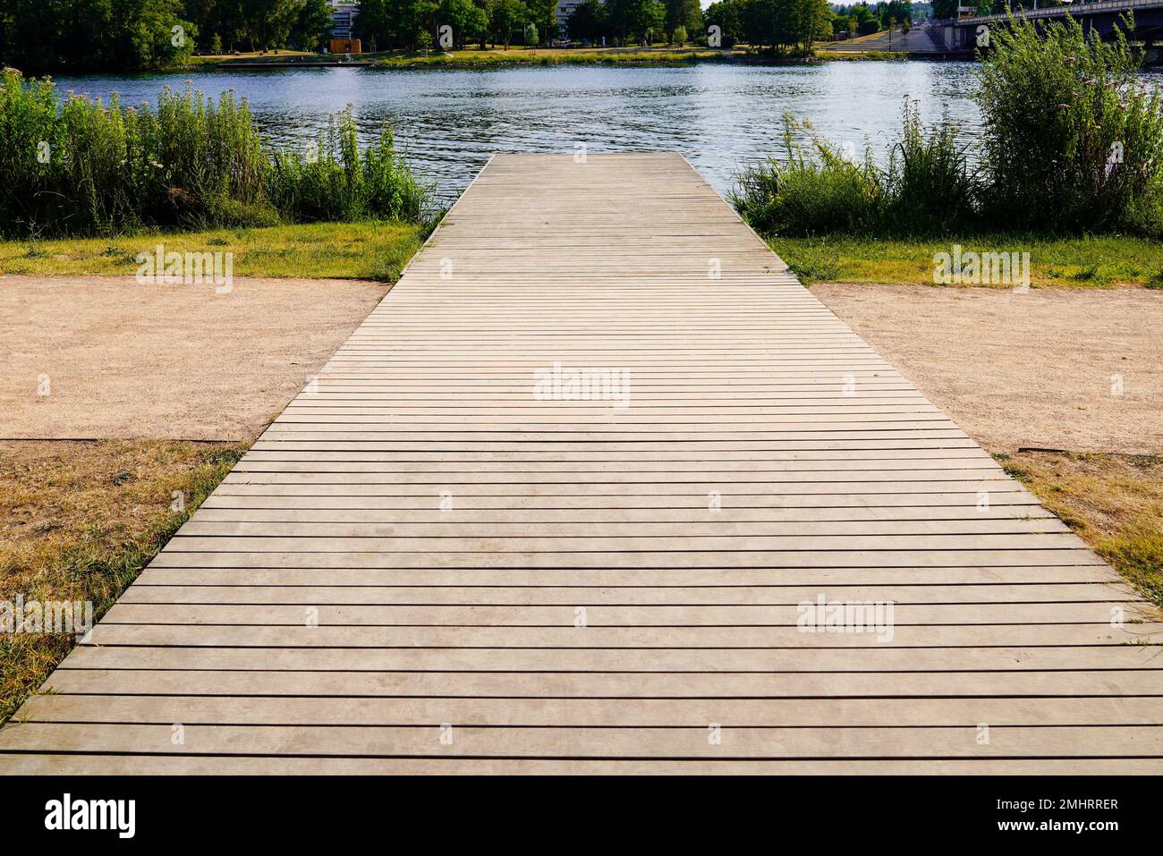 Wooden pontoon to access gingham Allier river coast in Vichy city ...