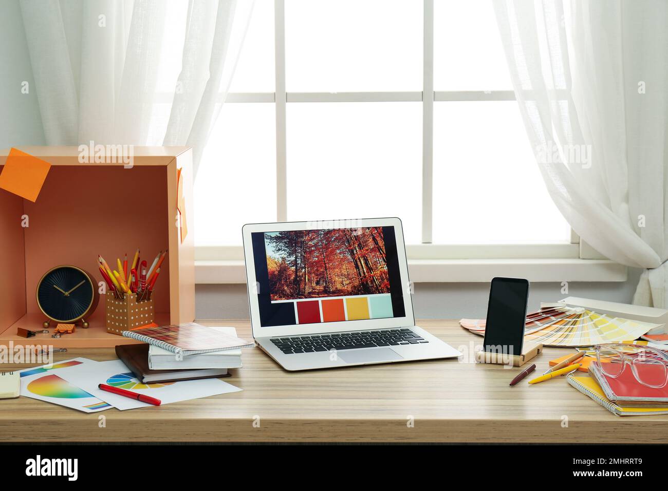 Designer's workplace with modern laptop and color palettes Stock Photo ...