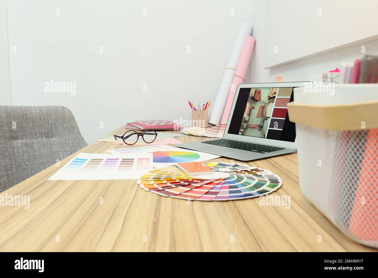 Designer's workplace with modern laptop and color palettes Stock Photo ...