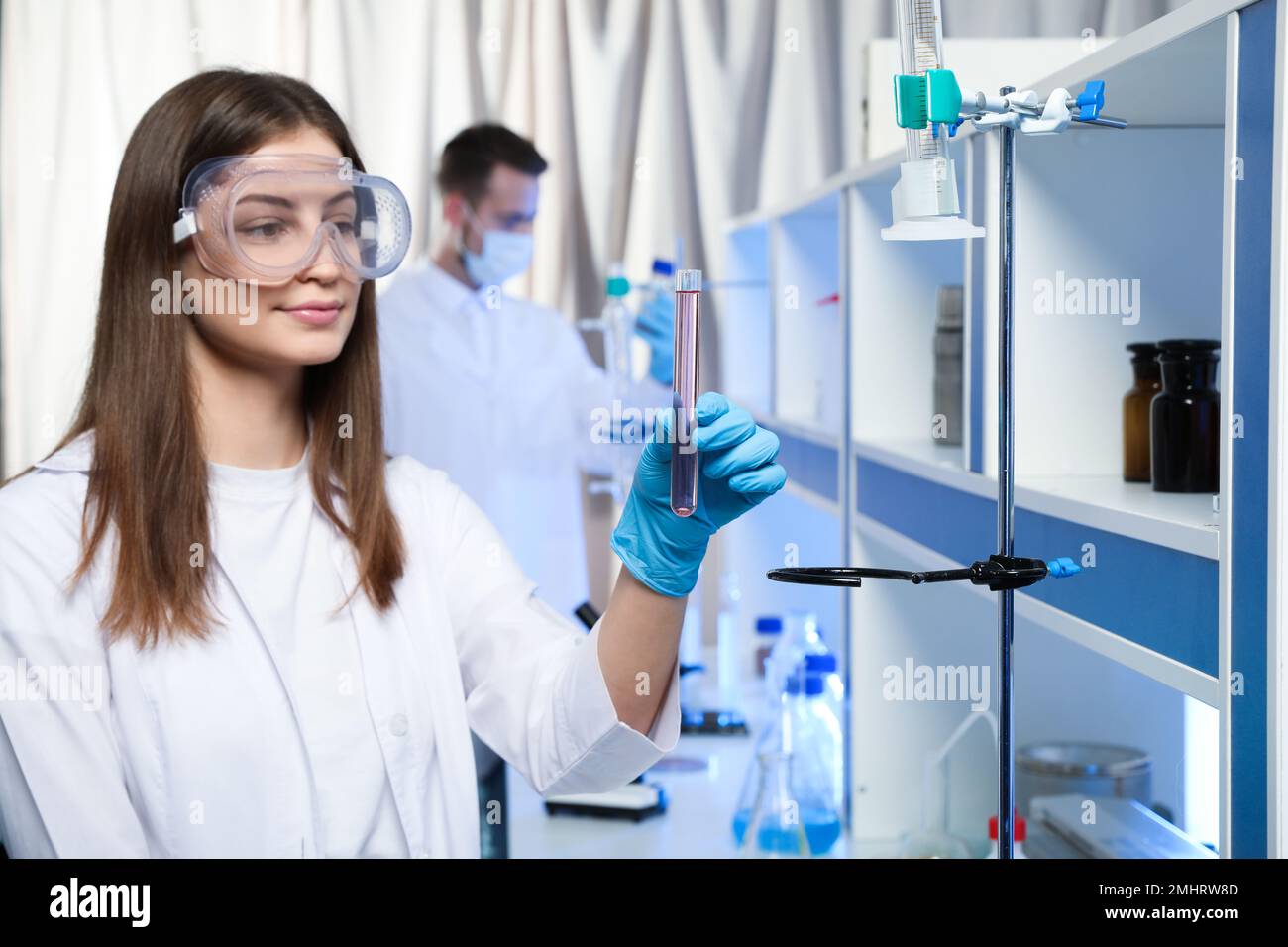 Scientist holding test tube with liquid indoors. Laboratory analysis ...