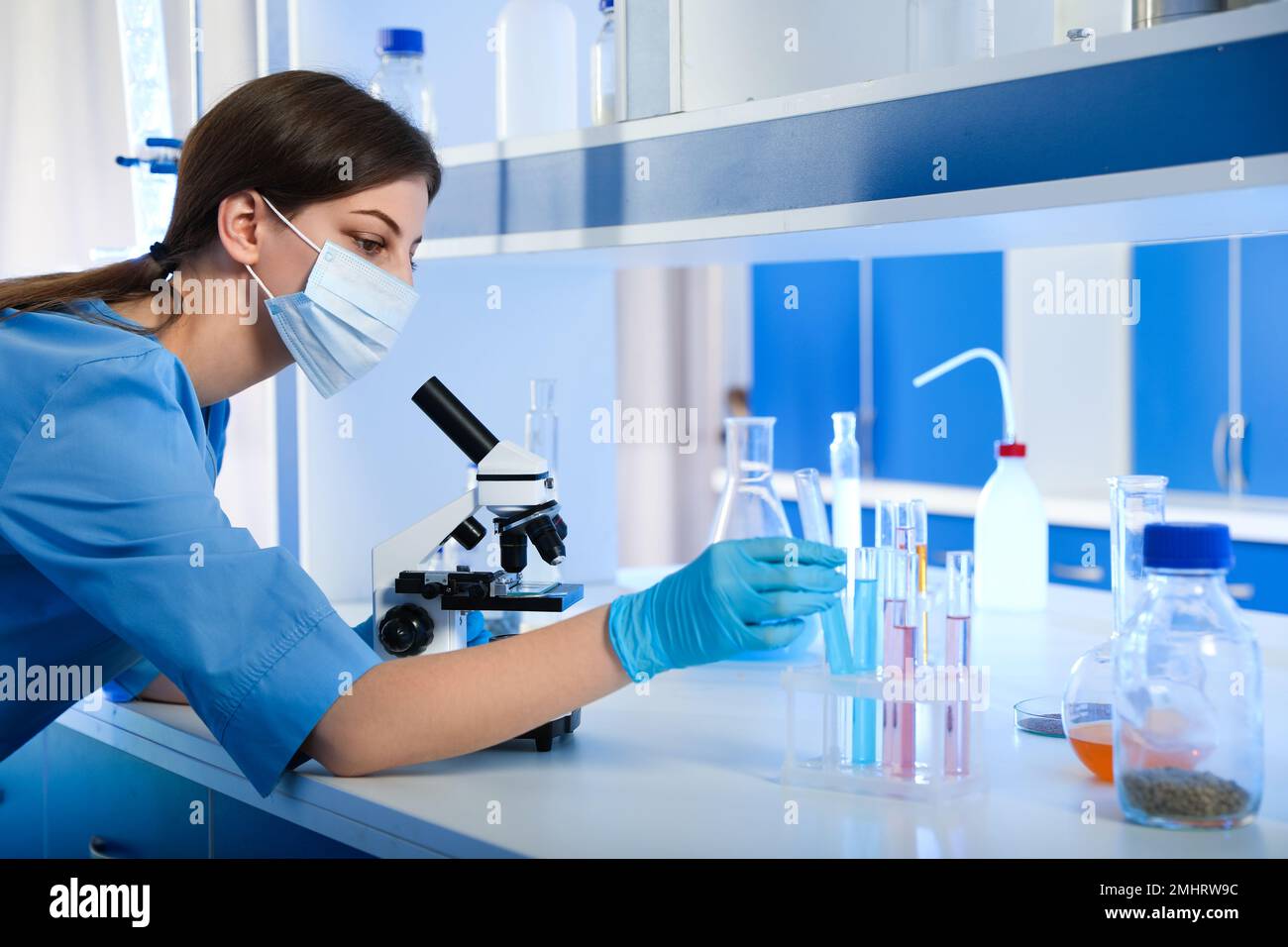 Female doctor test tubes microscope hi-res stock photography and images ...
