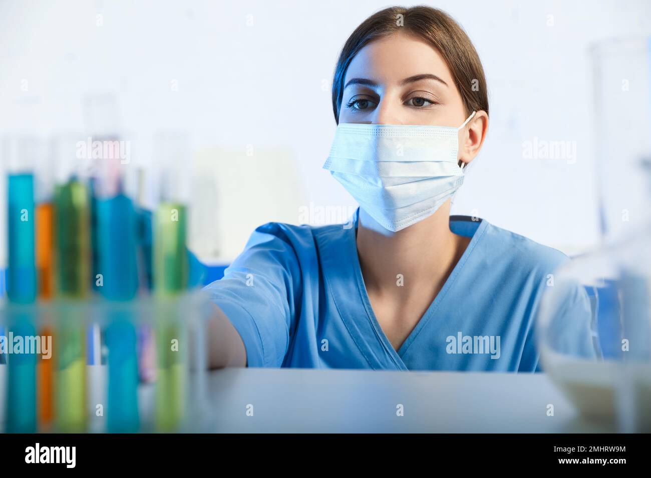 Scientist taking test tube from rack indoors. Laboratory analysis Stock ...