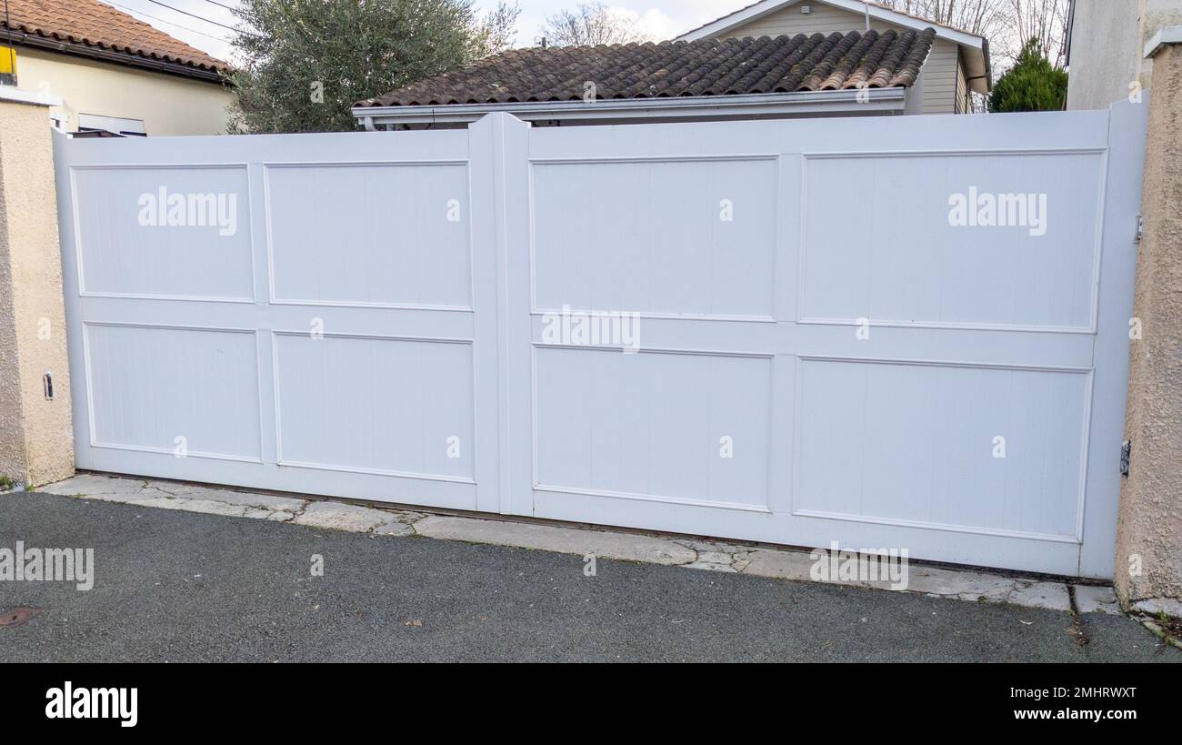 steel large white metal gate fence on modern house street Stock Photo ...