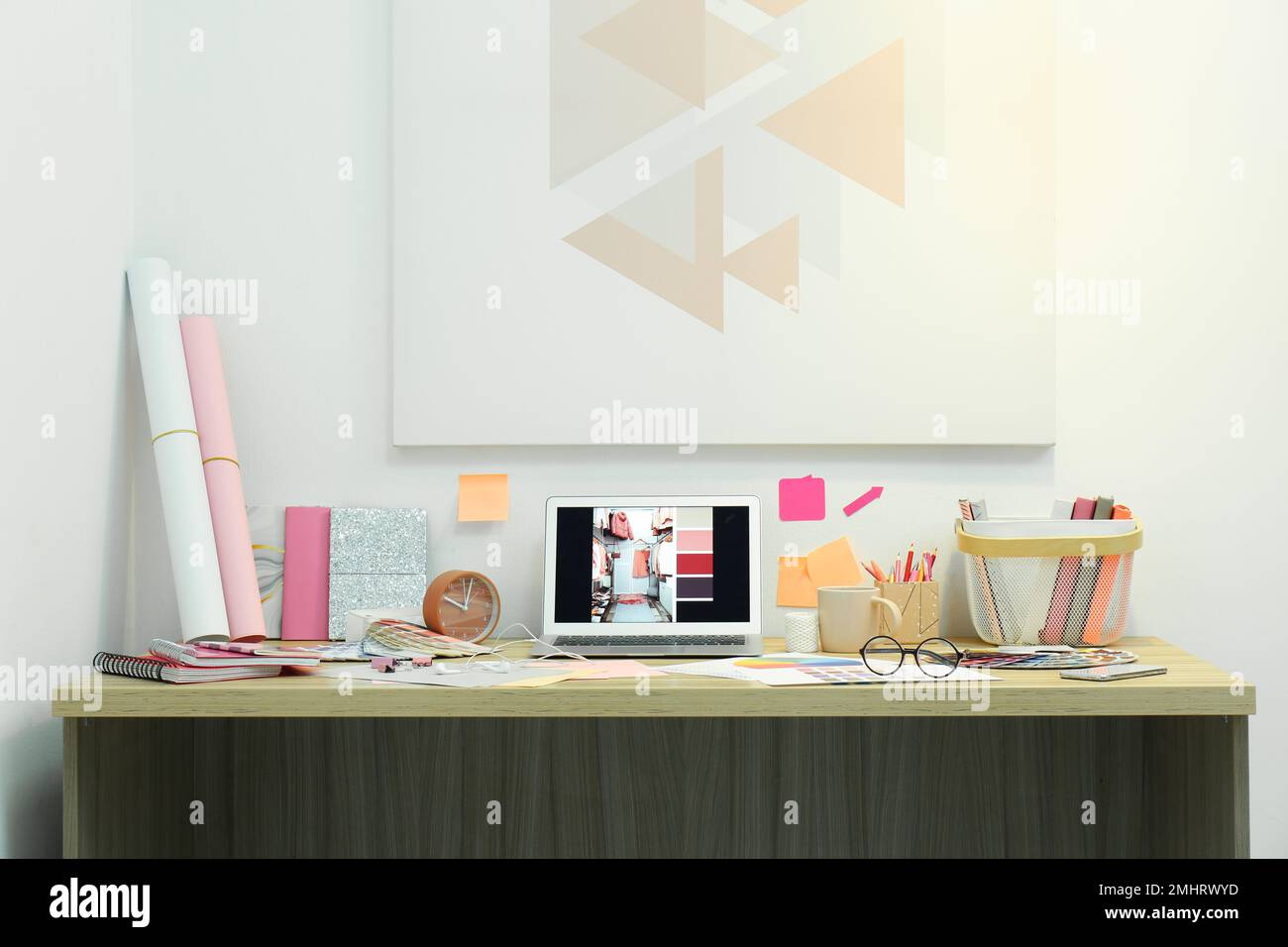Designer's workplace with modern laptop and color palettes Stock Photo ...