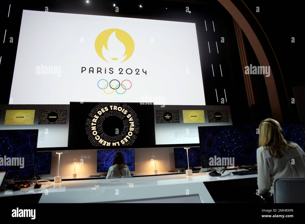 Paris 2024 Olympic logo is displayed on a screen during a ceremony, in ...