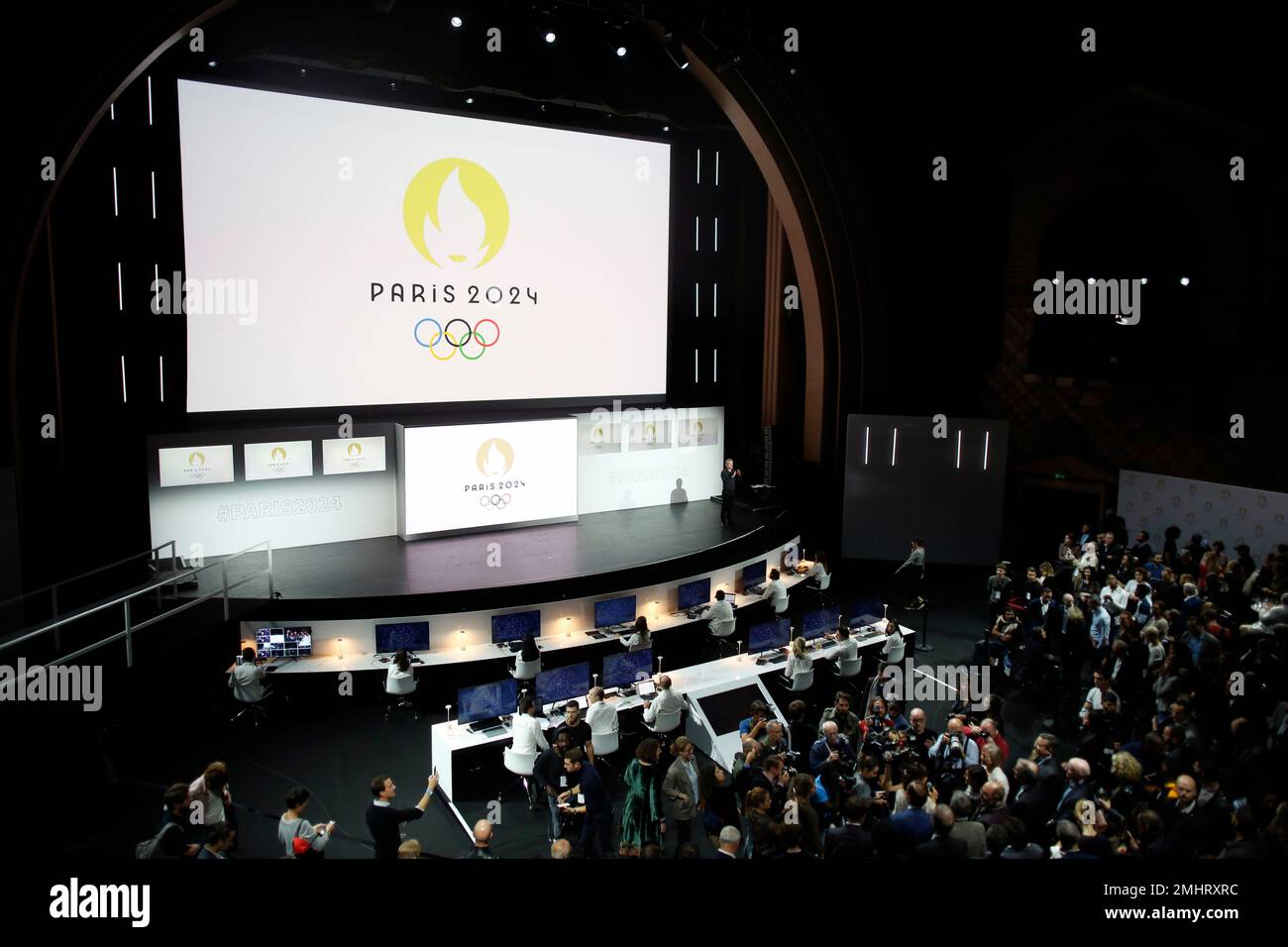 Paris 2024 Olympic logo is displayed on a screen during a ceremony, in ...