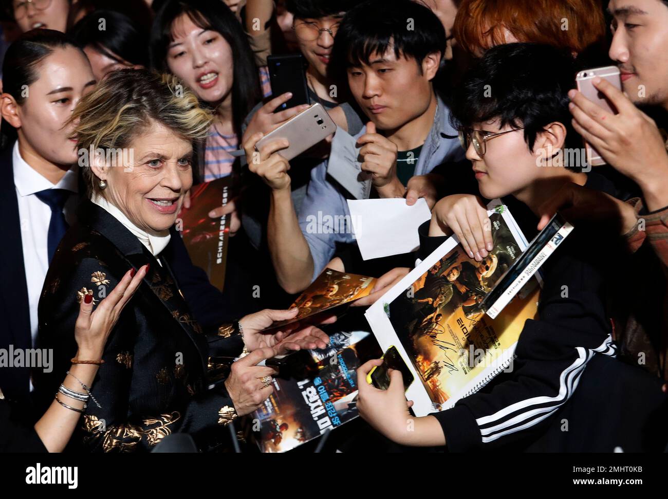 Actress Linda Hamilton signs autographs for fans during the premiere of ...