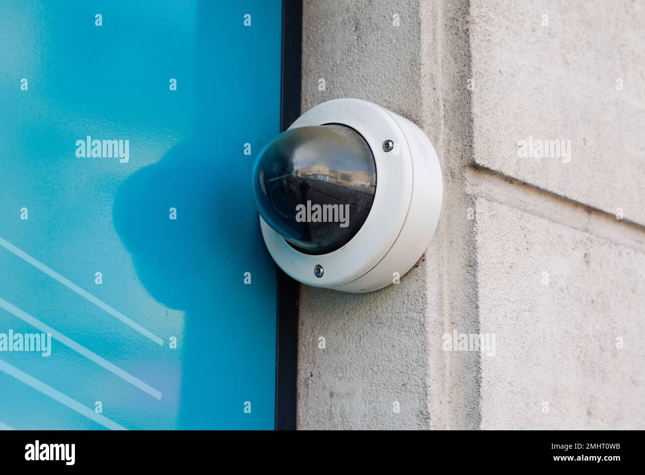 Security CCTV camera on wall in street Stock Photo - Alamy