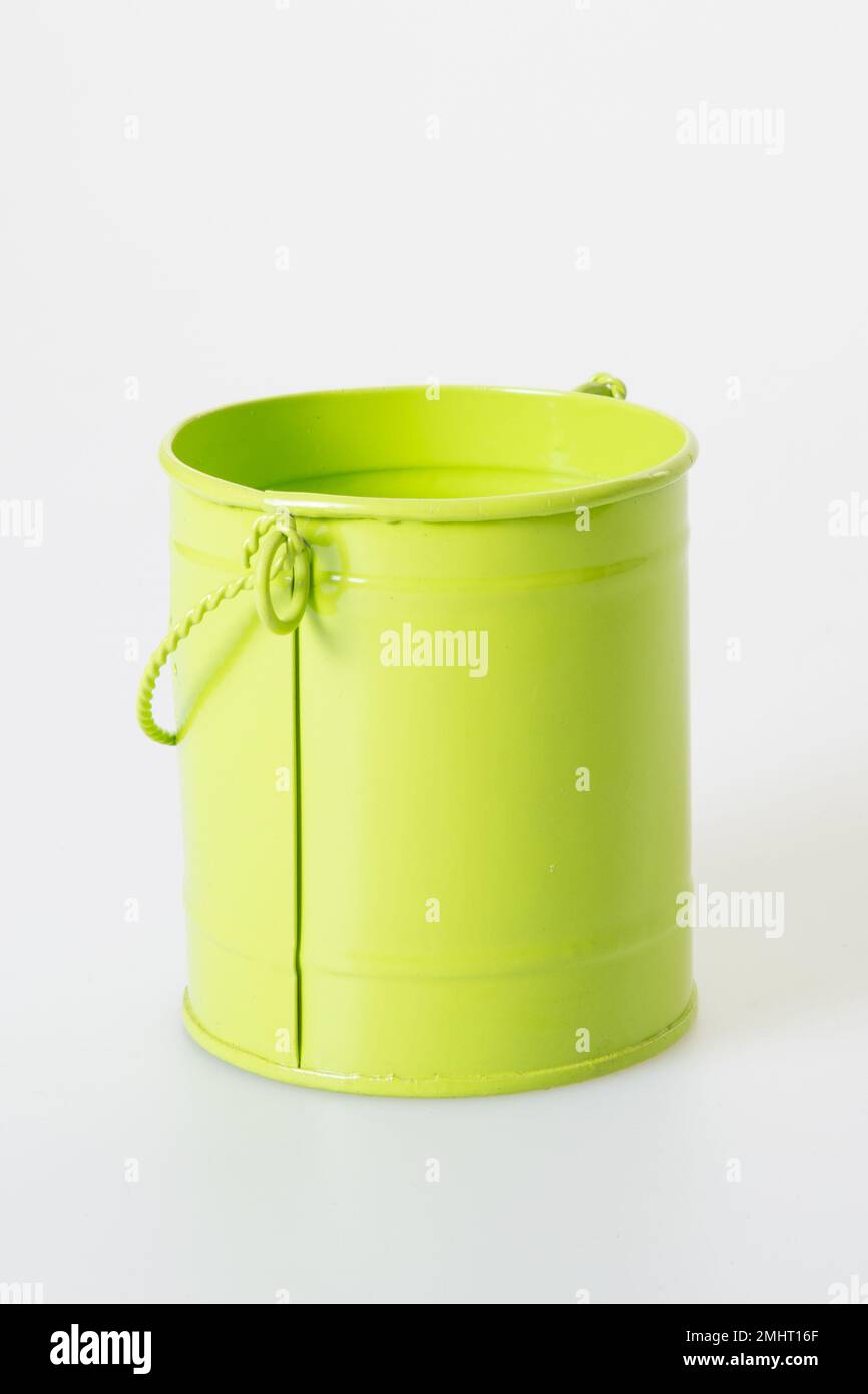 green metal bucket pastel on white background Stock Photo - Alamy
