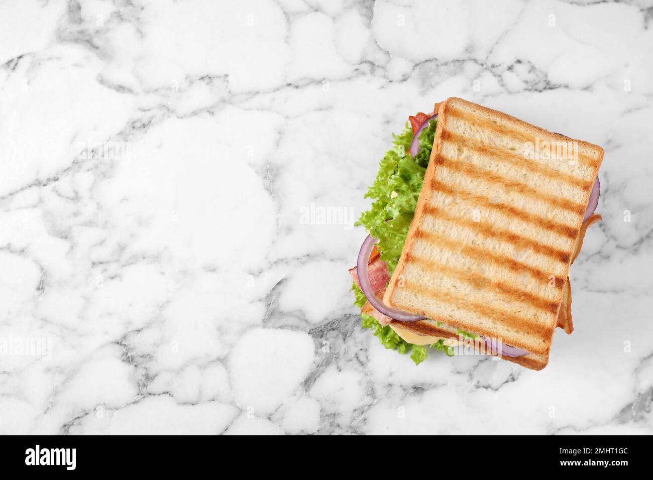 Tasty sandwich with toasted bread on white marble table, top view ...
