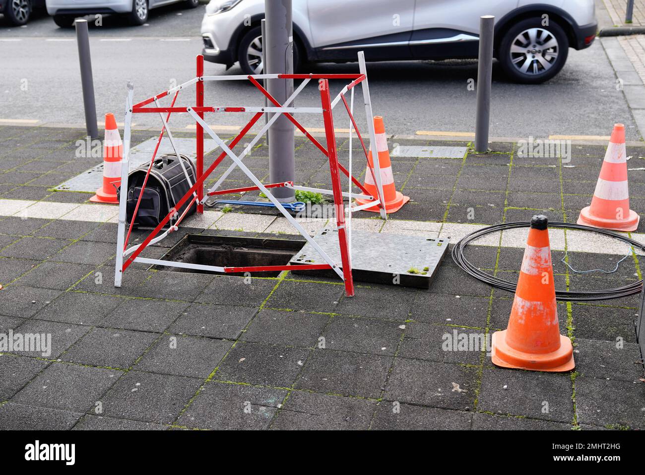 Open manhole with few cables connection internet using fiber optic ...
