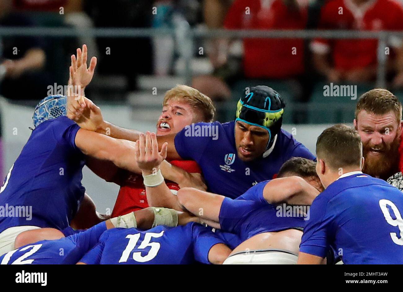 France's Sebastien Vahaamahina, center, elbows Wales' Aaron Wainwright ...