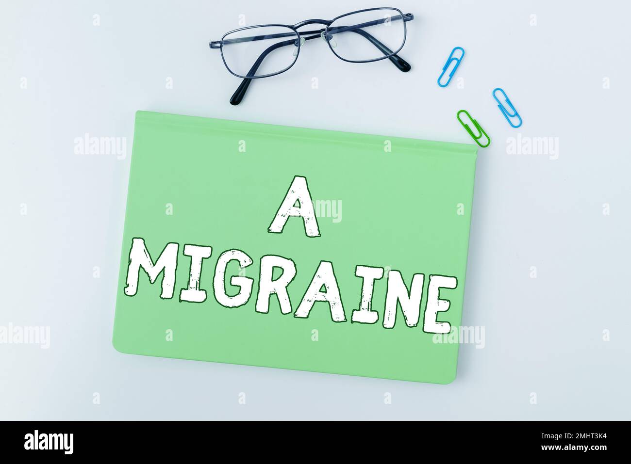 Hand writing sign A Migraine. Conceptual photo recurrent throbbing ...