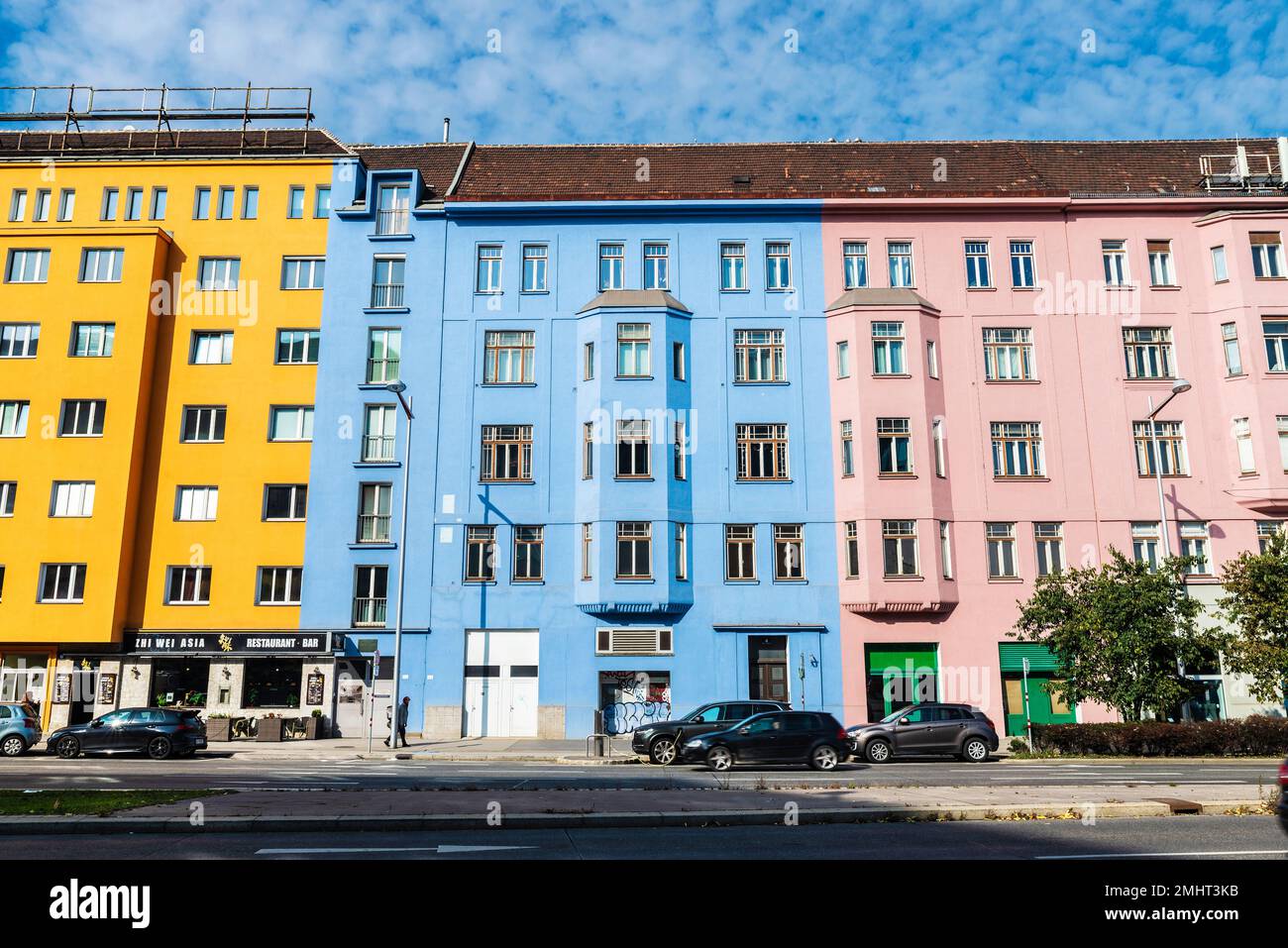 Vienna, Austria - October 16, 2022: Buildings with blue, yellow and ... Vienna, Austria - October 16, 2022: Buildings with blue, yellow and ...