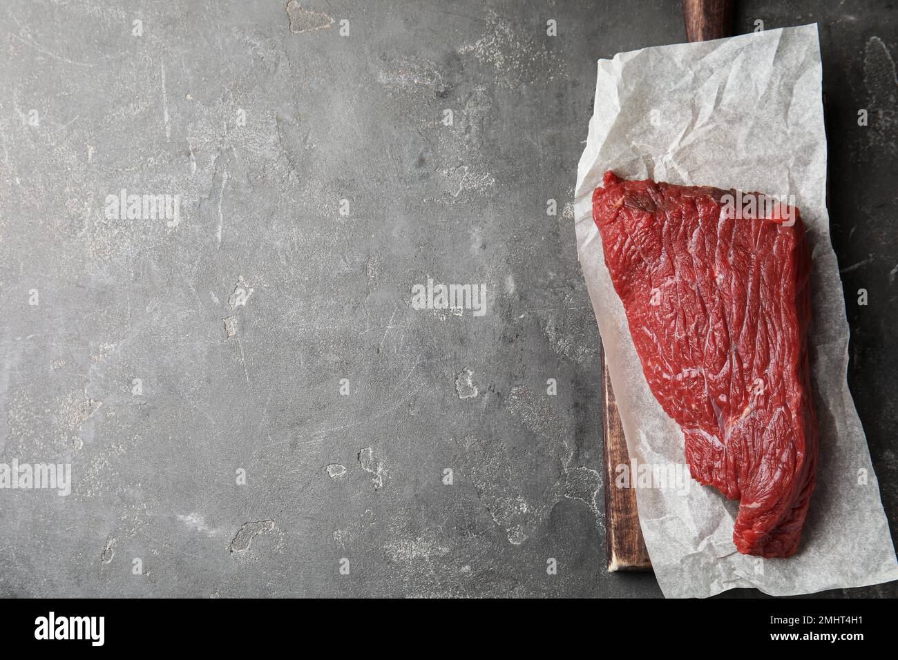 Fresh raw beef cut on grey table, top view. Space for text Stock Photo ...
